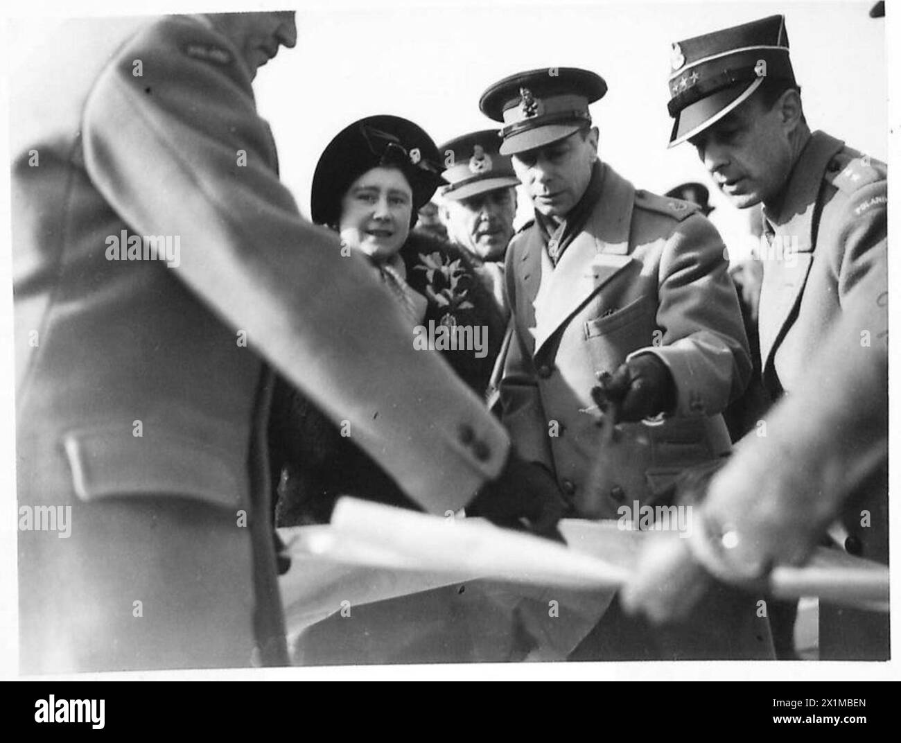 King George VI and Queen Elizabeth are shown plans of coastal defences manned by the 1st Polish ...