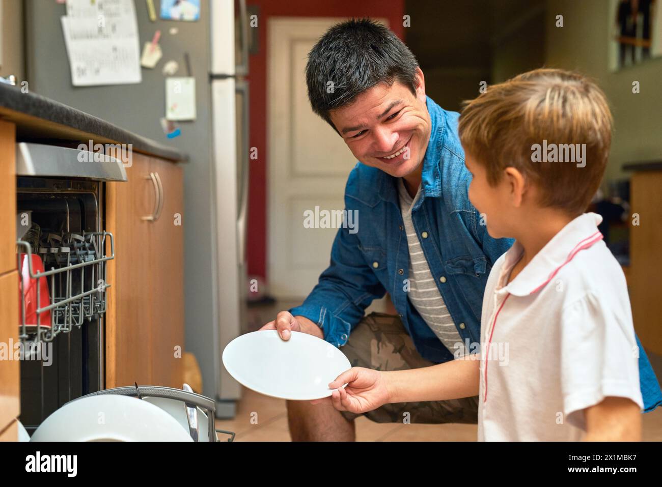 Father, son and learning or helping with dishwasher for discipline ...