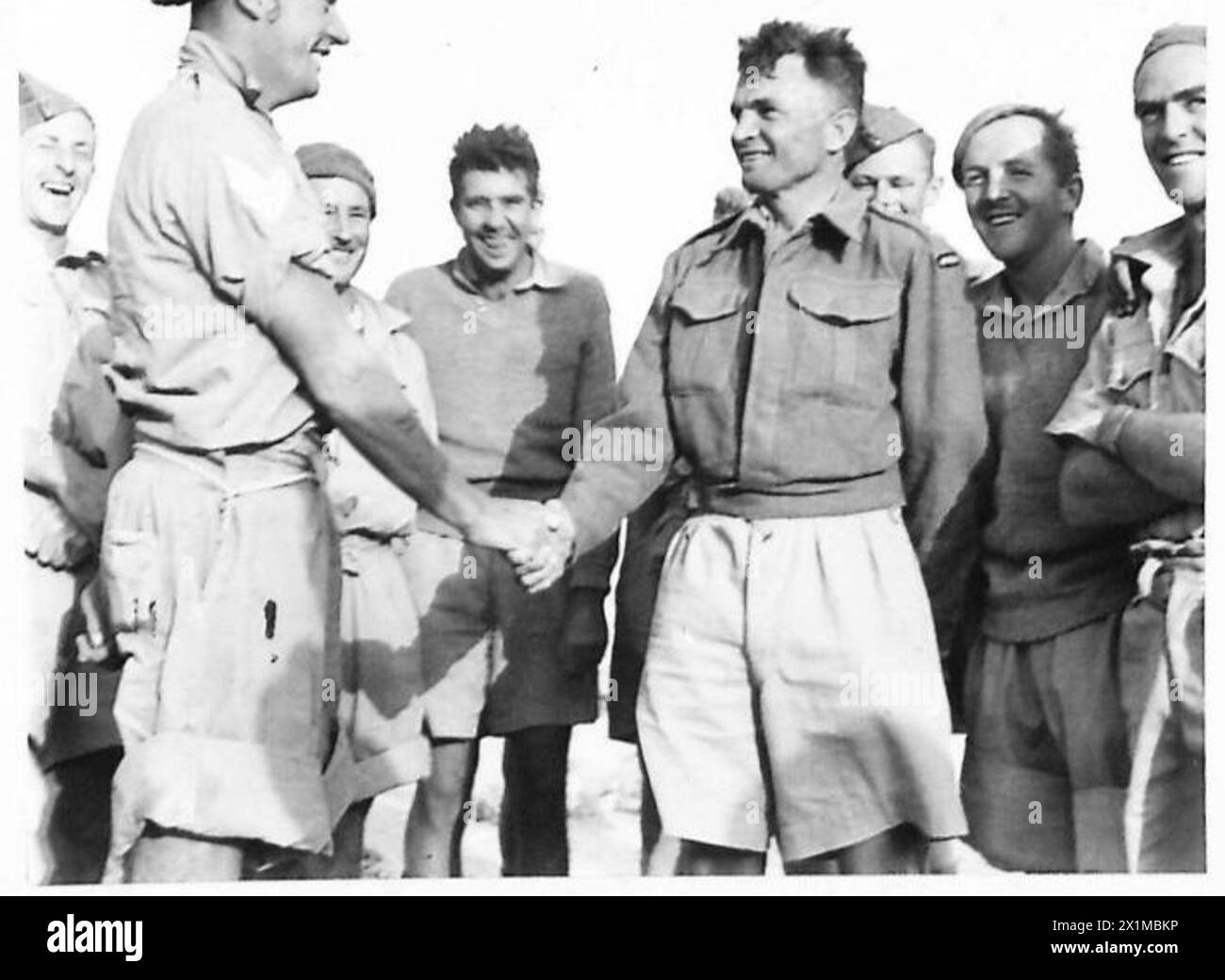 2nd Lieutenant Charles Hazlitt Upham is congratulated by his platoon ...