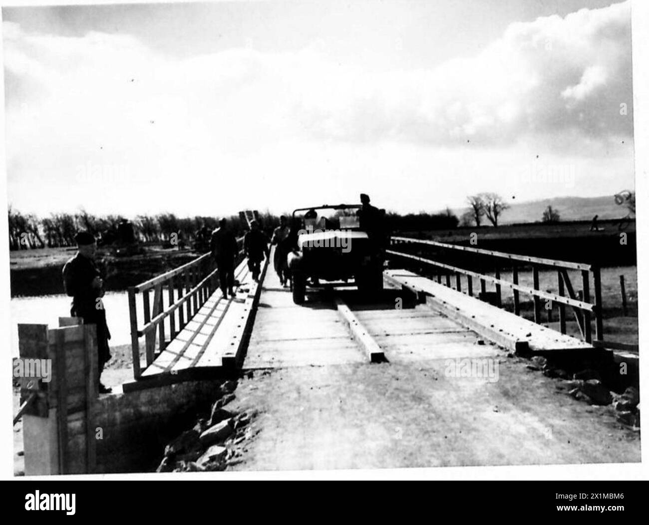 A British Army lorry crosses a newly constructed auxiliary bridge ...