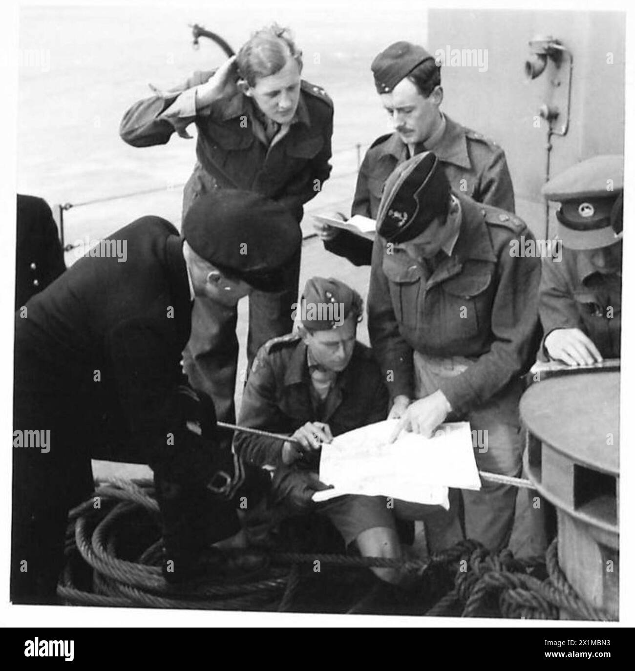 COMBINED OPERATIONS EXERCISE - Commando officers study a map before the ...