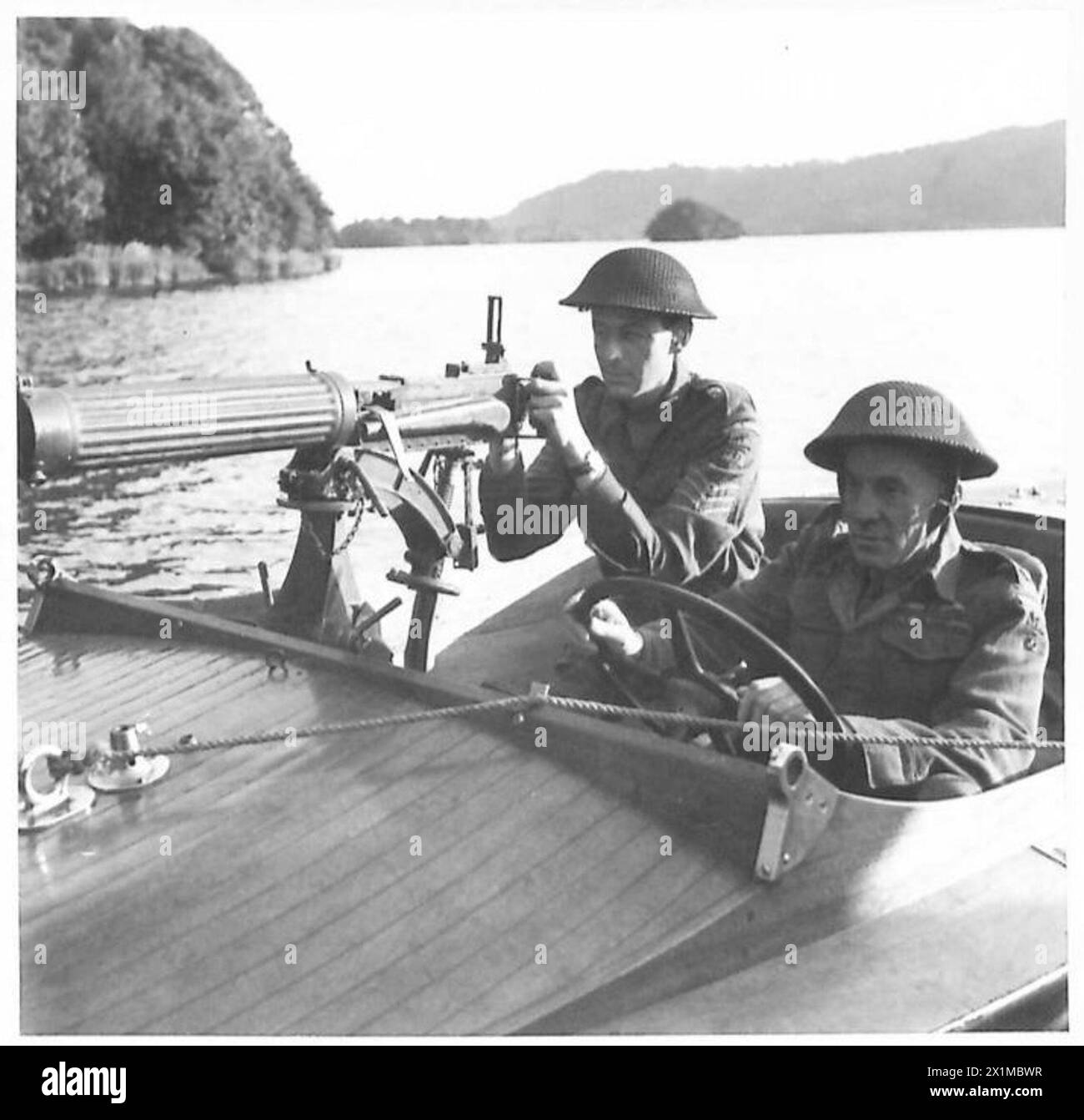 HOME GUARD "MARINES" - A Vickers gunner with gun mounted in speed boat ...