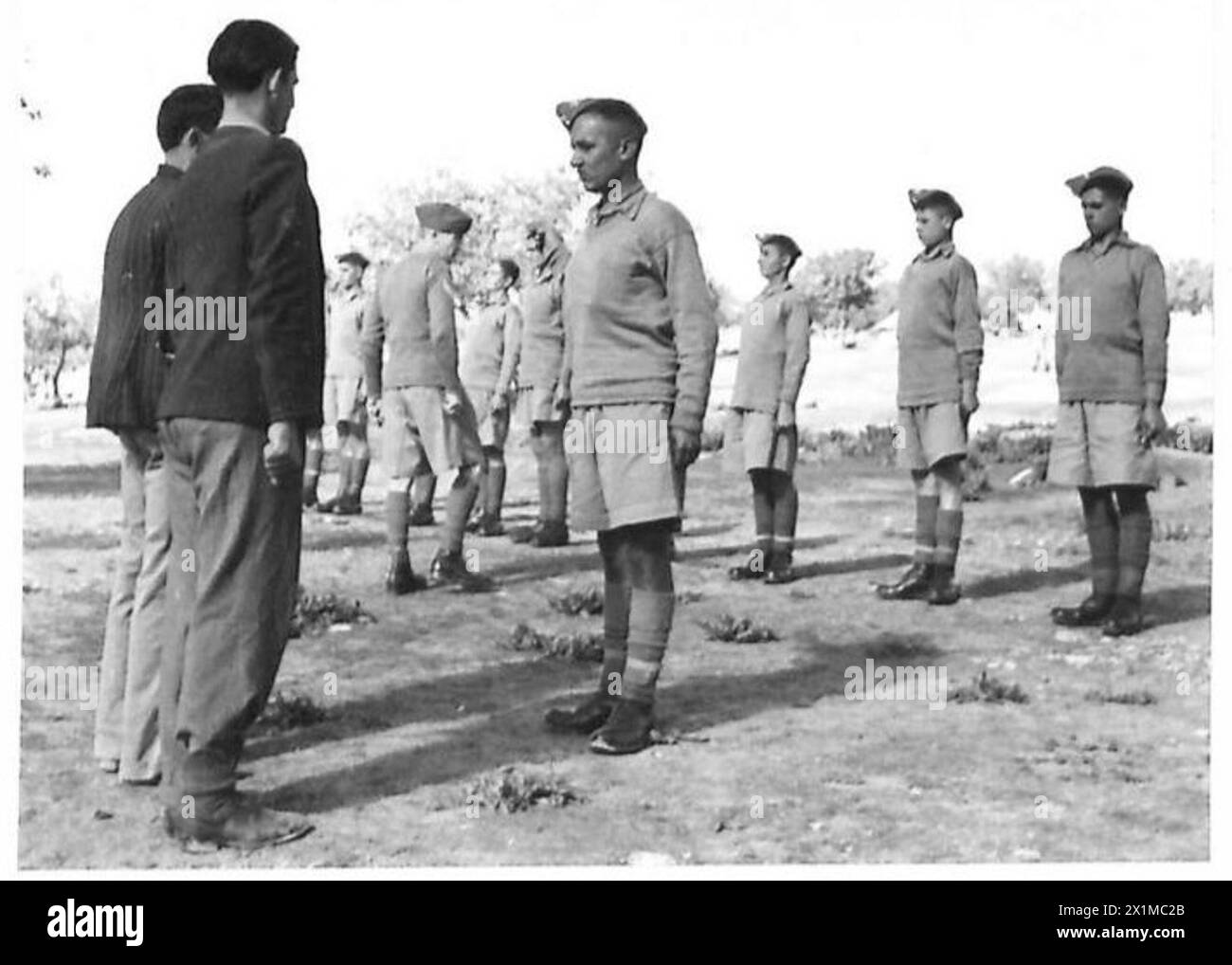 Cypriot recruits observe fellow troops performing drills during ...