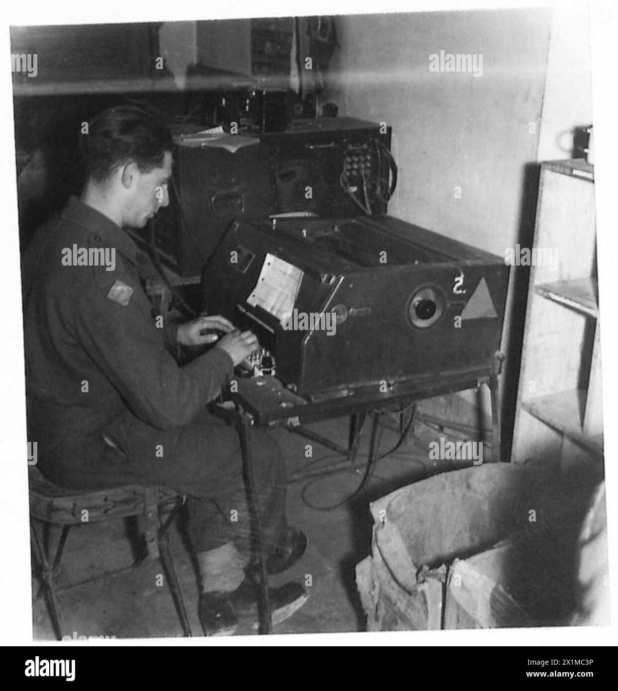 "LINES OF COMMUNICATION"(War Office Request) - An operator on a British Cread teleprinter ...