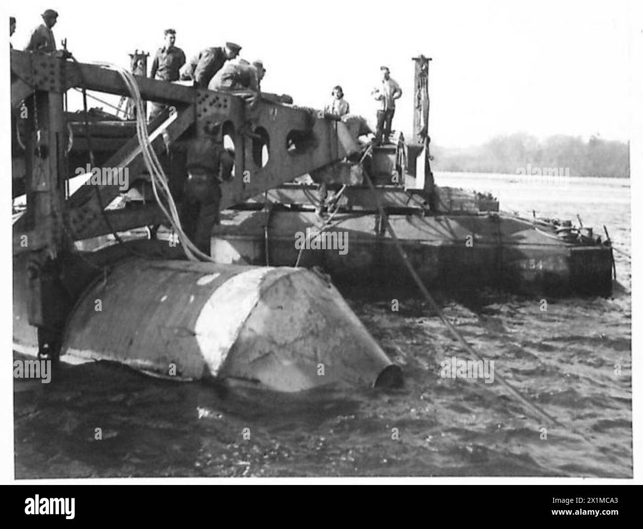 The British Army launches a shuttle boat from a bridge at Garlieston ...