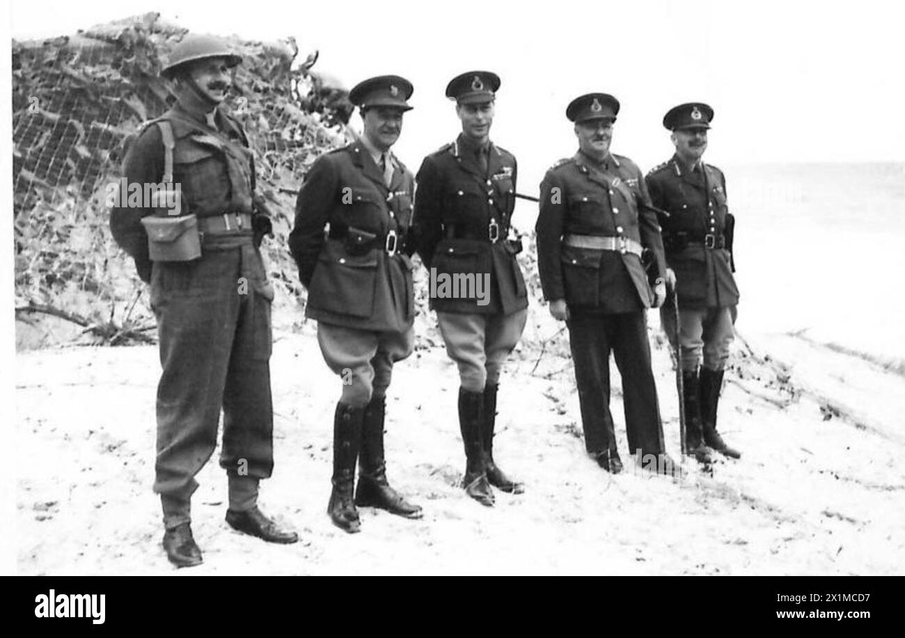 The King inspects coastal defences at Palling alongside officers ...