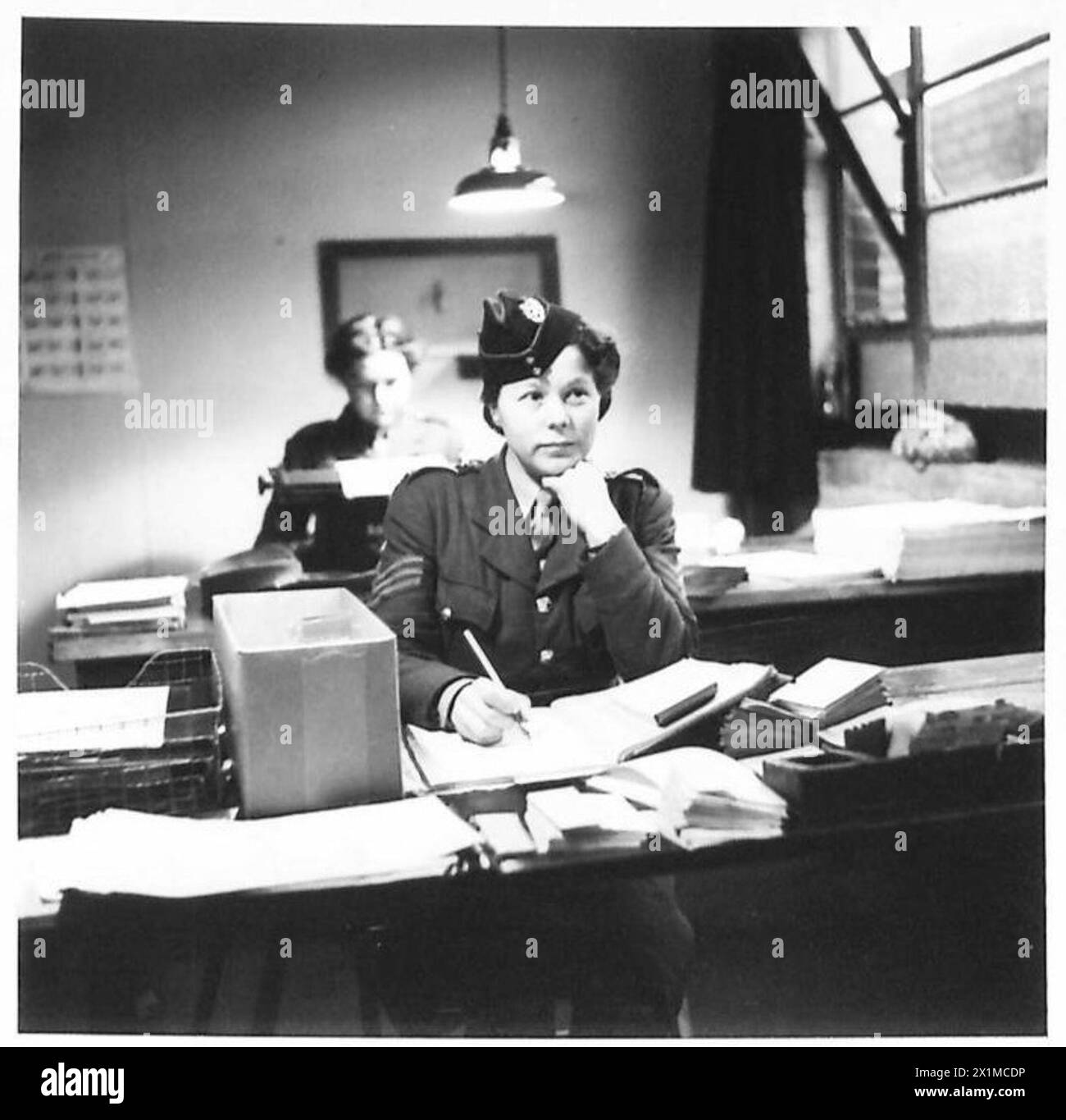 Sgt. Mrs. R. Thompson serves at an RAOC depot, with two years of ...