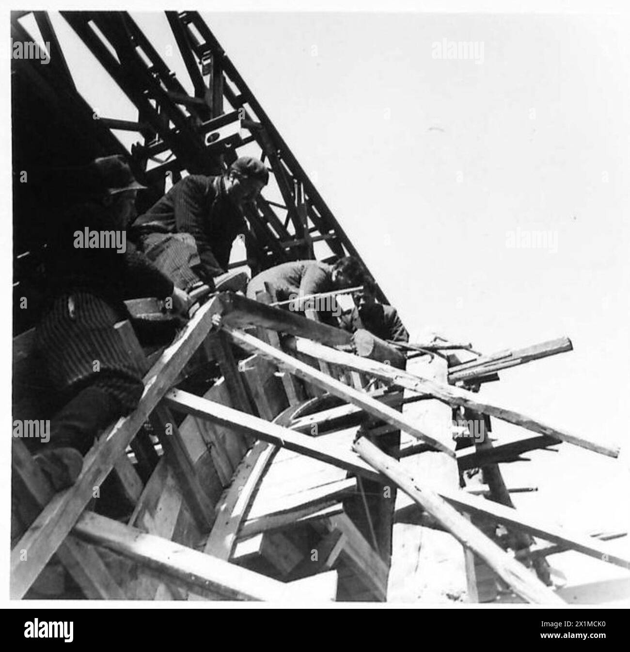 Greek labourers work on constructing a new bridge one mile from Pelasia ...