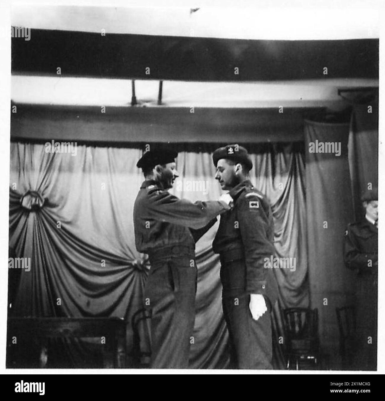 11th ARMOURED DIV INVESTITURE - Capt L. Moody, 3 MON receives the MC ...