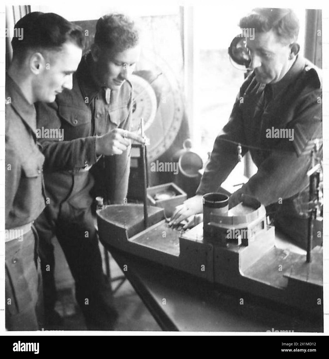 WATERBORNE TRAINING CENTRE [R.A.S.C.] - With the aid of a model ship ...