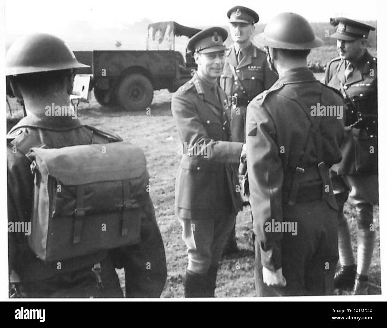 The King is introduced to British Army officers during his tour ...