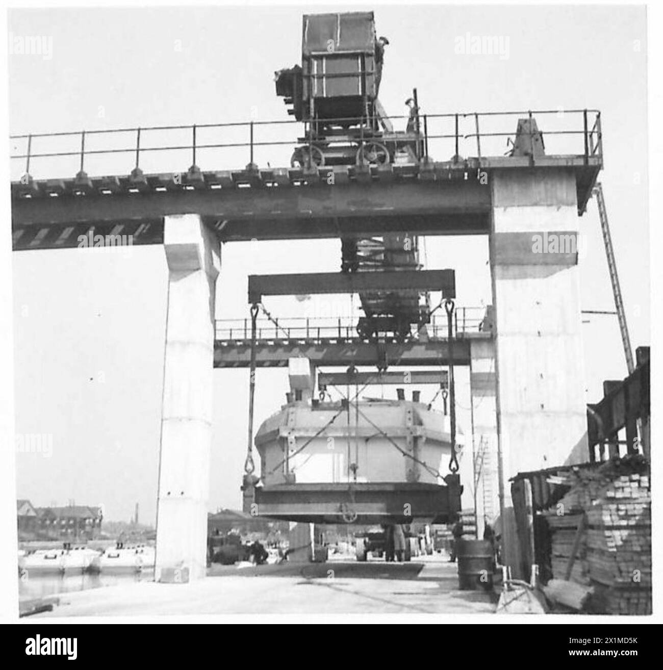 Personnel of TN.5 work on Beetle vehicles at West India Dock under the ...