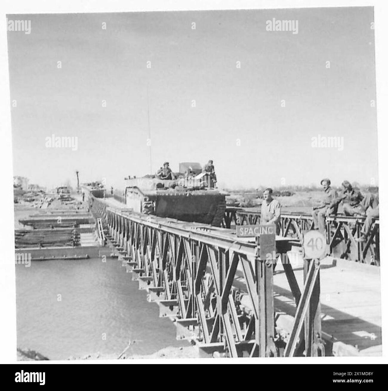 Fantail vehicles of the Commando Brigade are guided across a Bailey ...