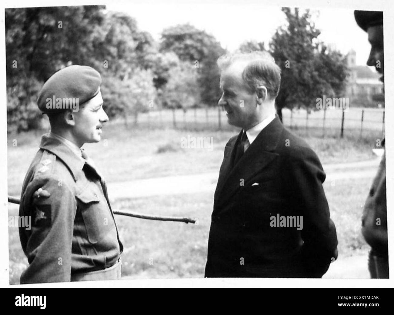 Mr. Arthur Henderson talks with Lieutenant J.A. Buchanan, MC., a former ...