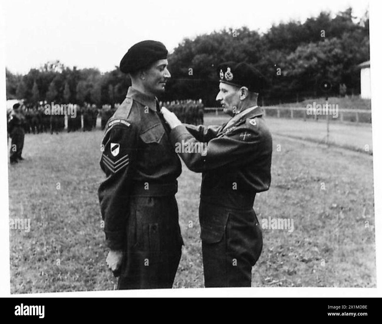 Sergeant S. Wheeler of the 4th Tank Coldstream Guards receives the ...