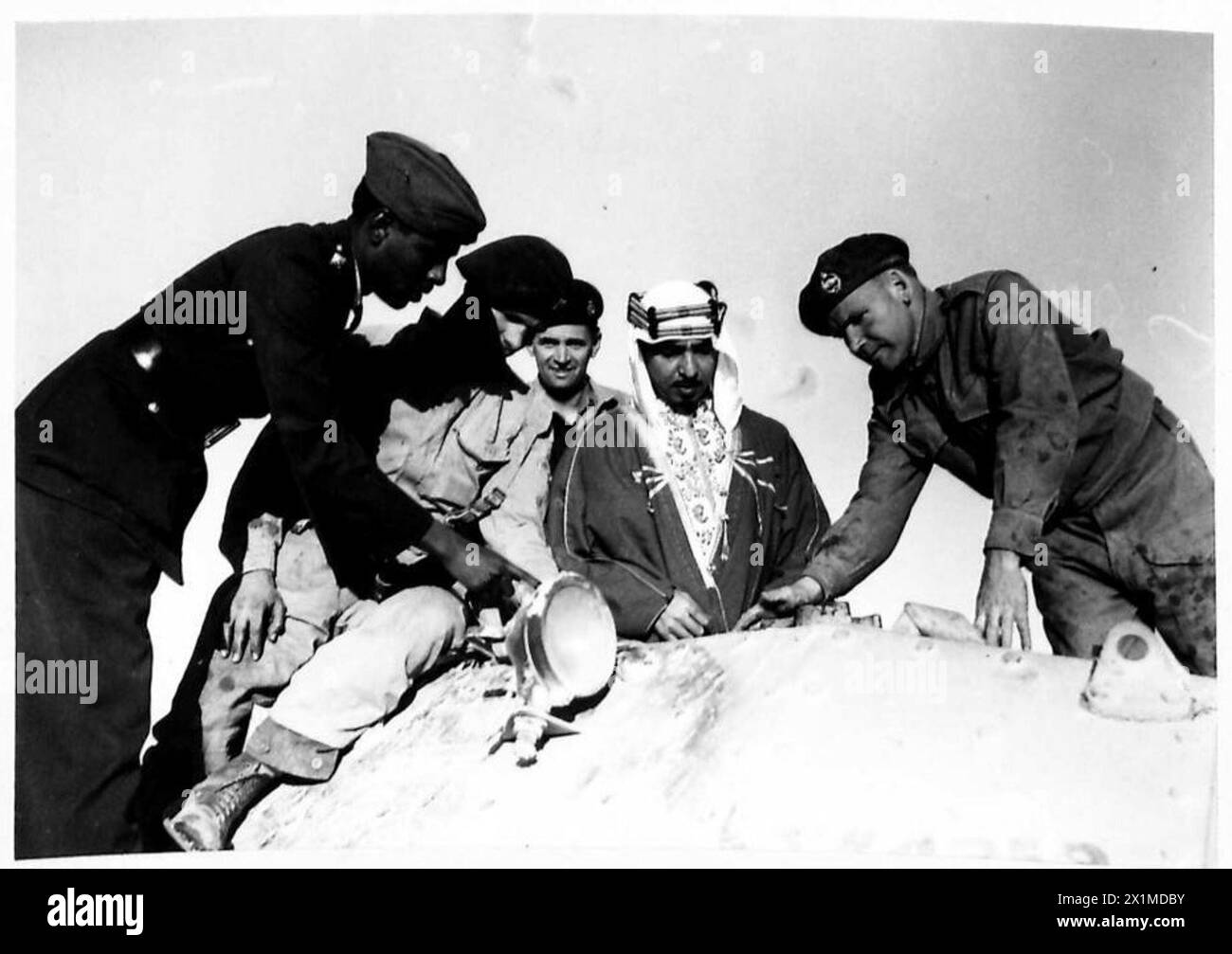 Emir Fawaz al Shaalan inspects a Valentine tank during his visit to ...