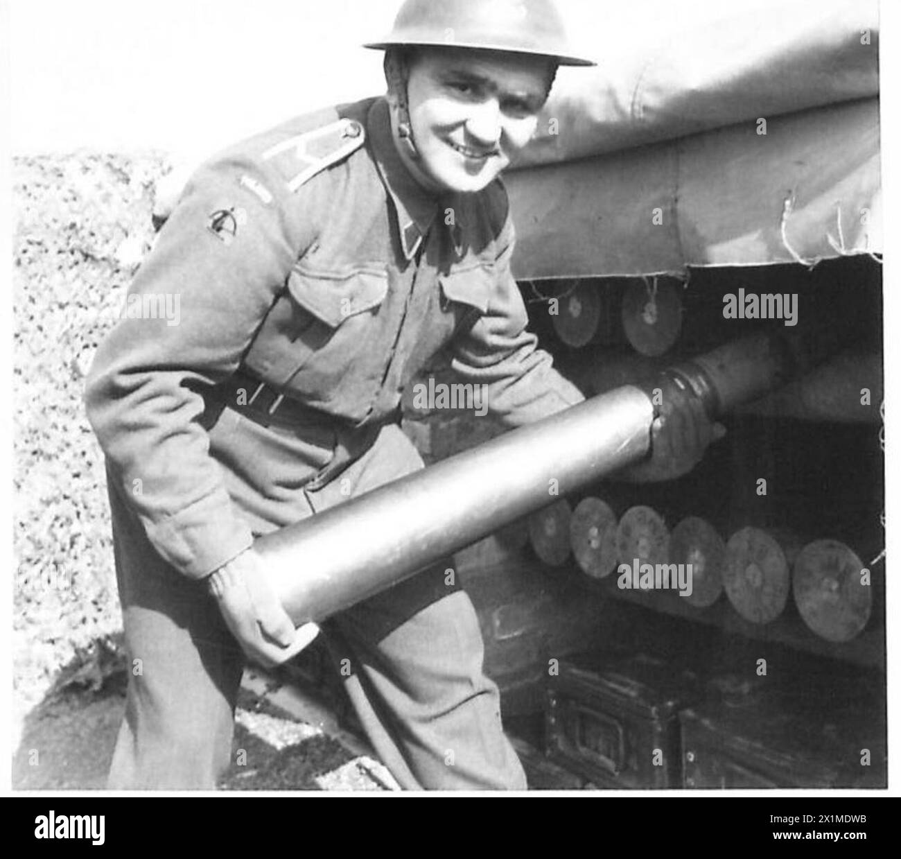 Sergeant W. Stolarski of the Polish Army delivers ammunition to a 3.7 ...