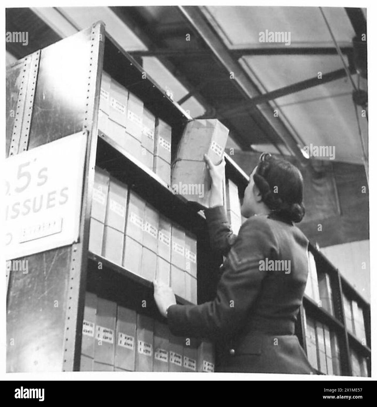 An ATS member organizes box files made from scrap cardboard at the ...