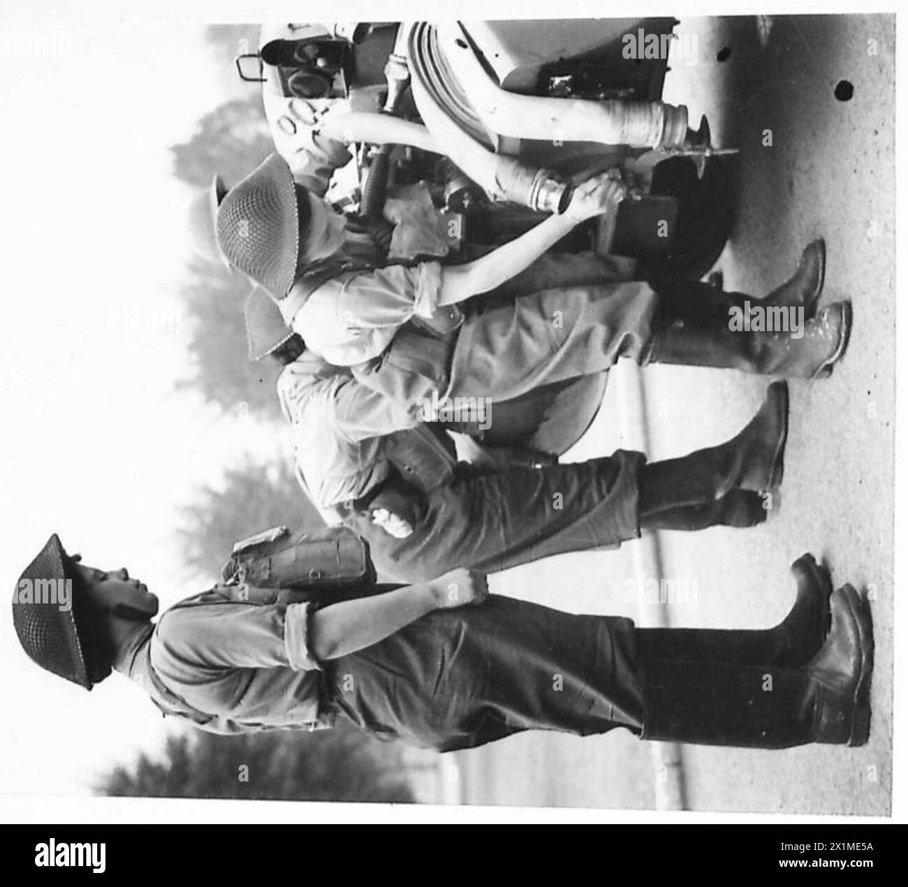 AT AN A.T.S. TRAINING CENTRE - ATS Fire Squad in training. The hose ...