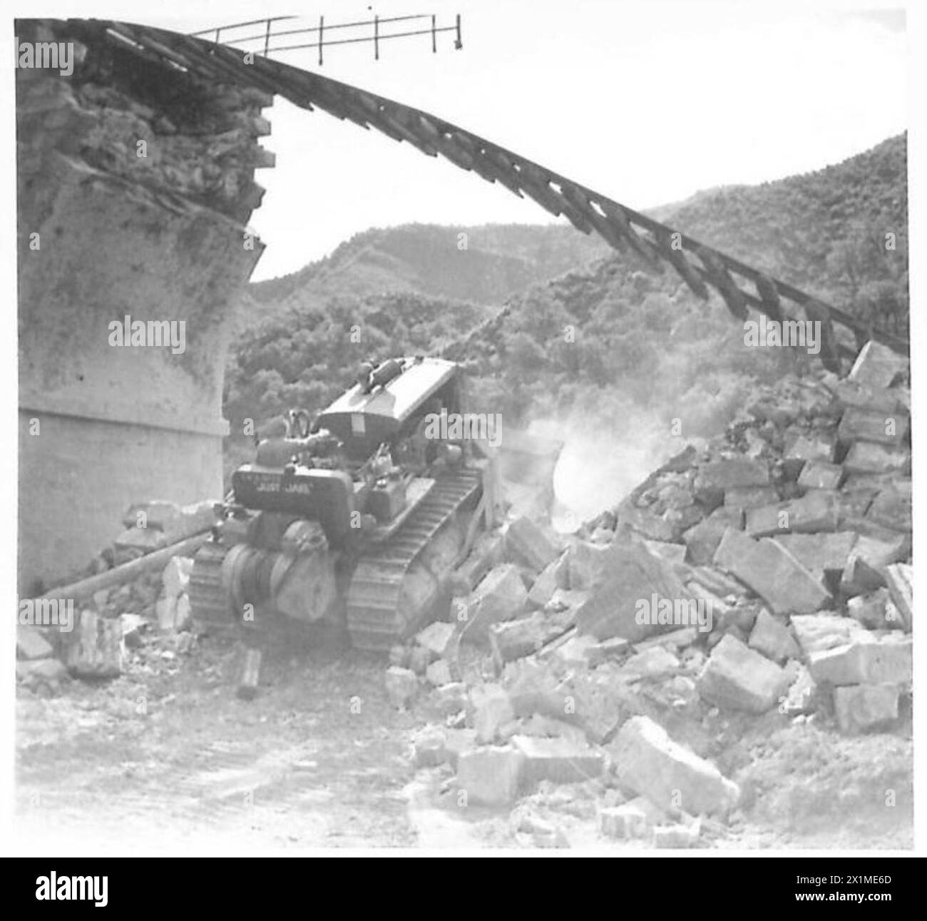 ITALY : EIGHTH ARMY - A bulldozer follows on the heels of the infantry ...