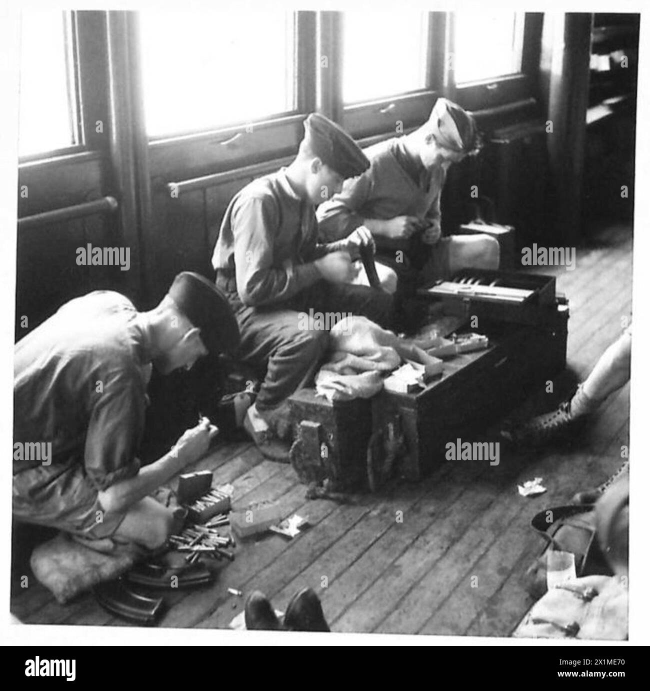 COMBINED OPERATIONS EXERCISE - Commandos busily engaged loading Bren ...