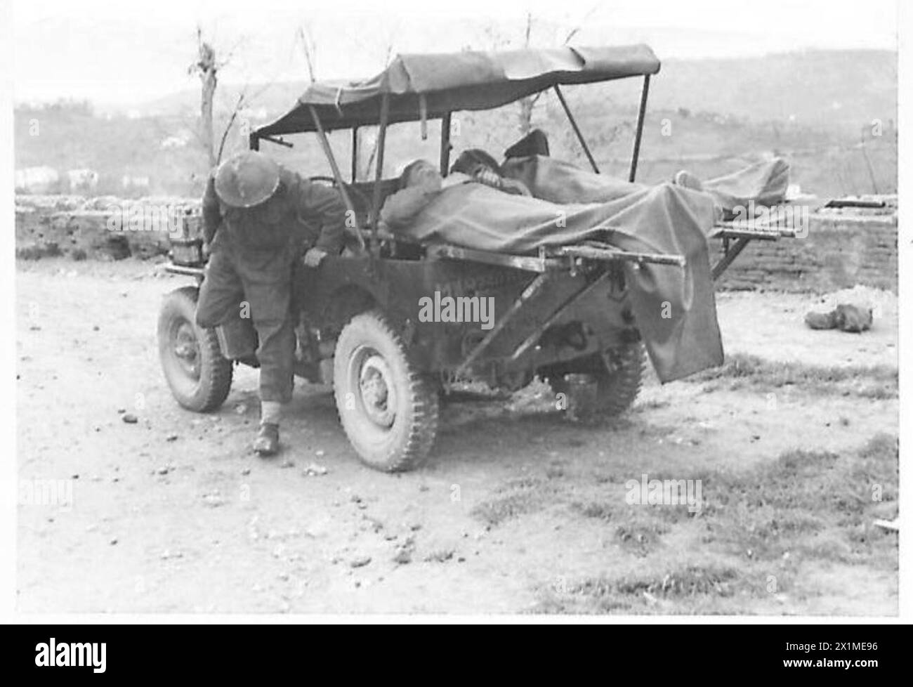 A field surgery unit operates in Italy with a Jeep transporting ...