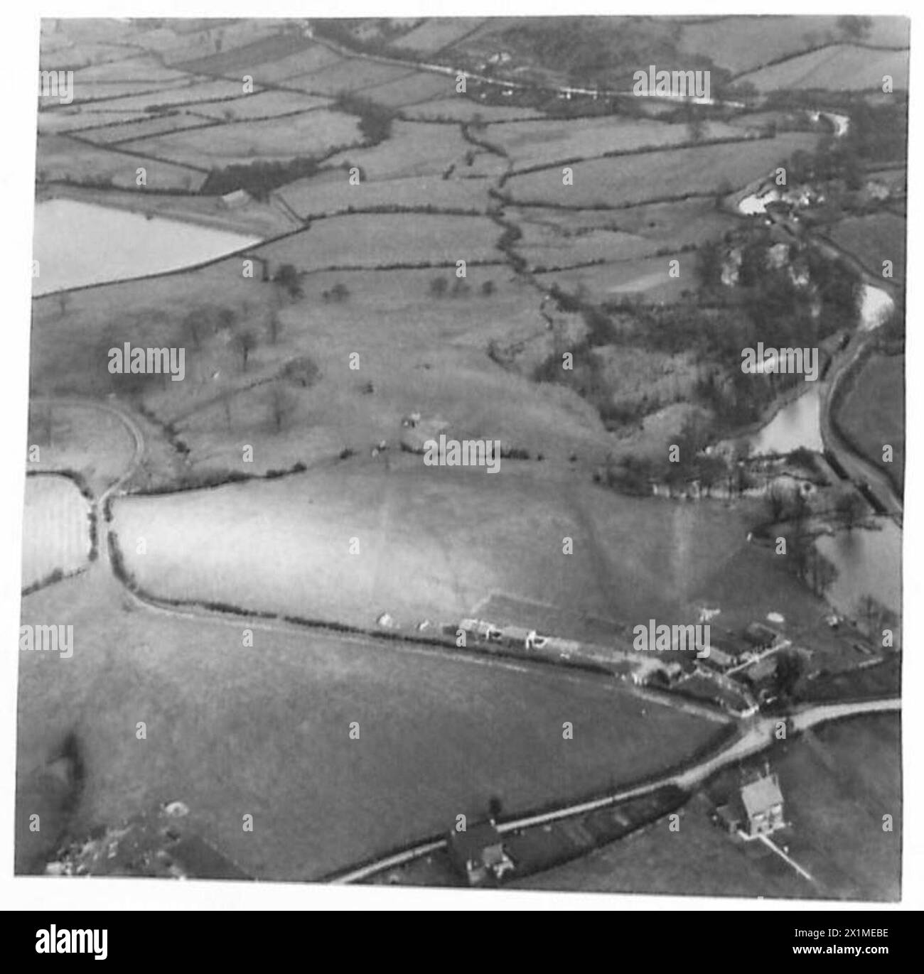 Aerial camouflage is applied to anti-aircraft gun and searchlight sites ...