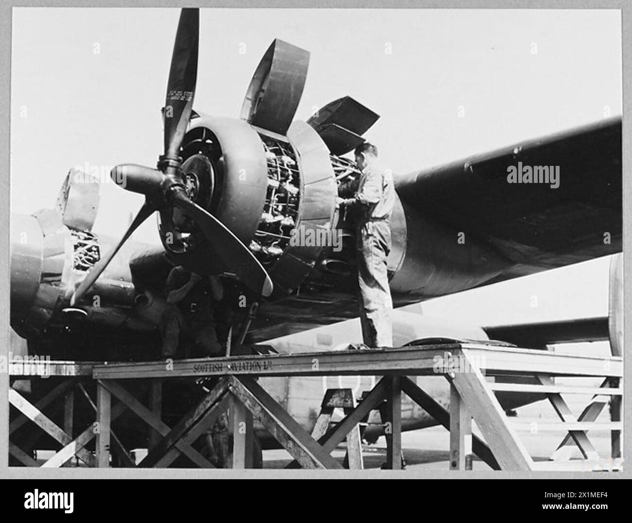 In 1945, ground crew perform maintenance on a B.O.A.C. Liberator ...