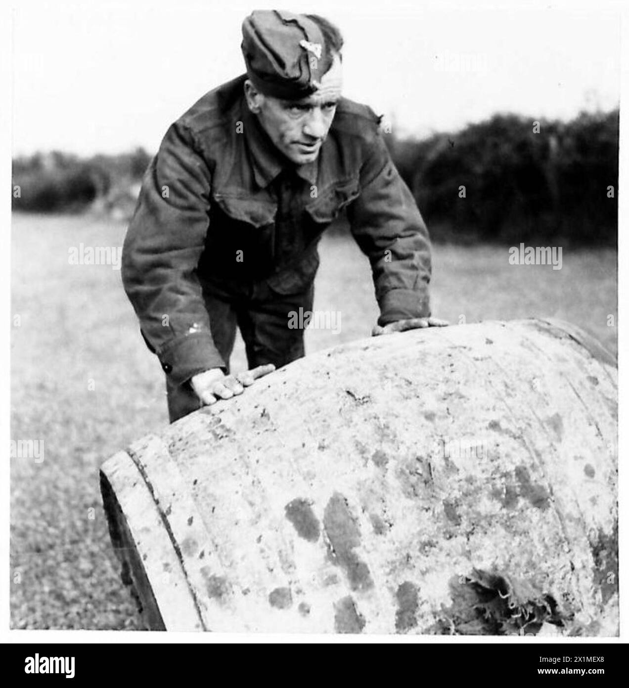 THE PIONEER CORPS - A tar barrel is rolled into postion, British Army ...