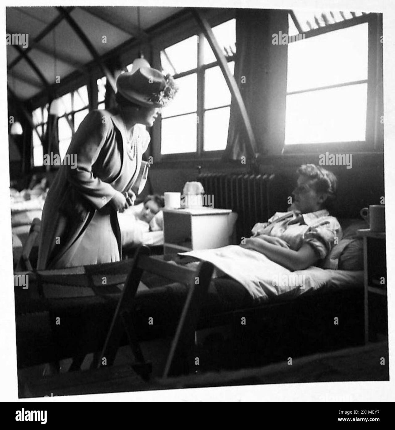 HER MAJESTY THE QUEEN VISITS ATS - HM the Queen talking to an ATS ...