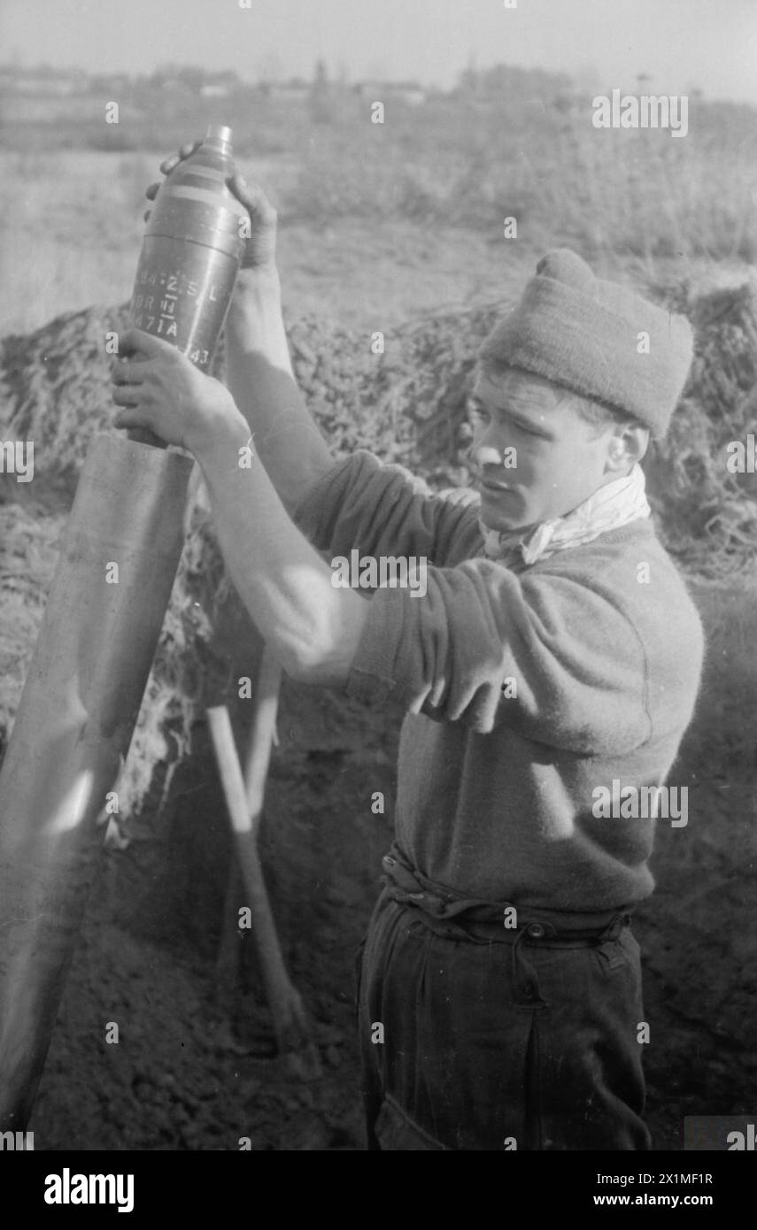 THE BRITISH ARMY IN NORTH-WEST EUROPE 1944-45 - Loading a 4.2-inch ...