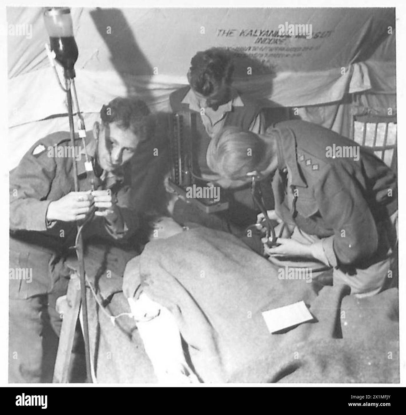 During a blood transfusion in forward areas, British Army personnel ...