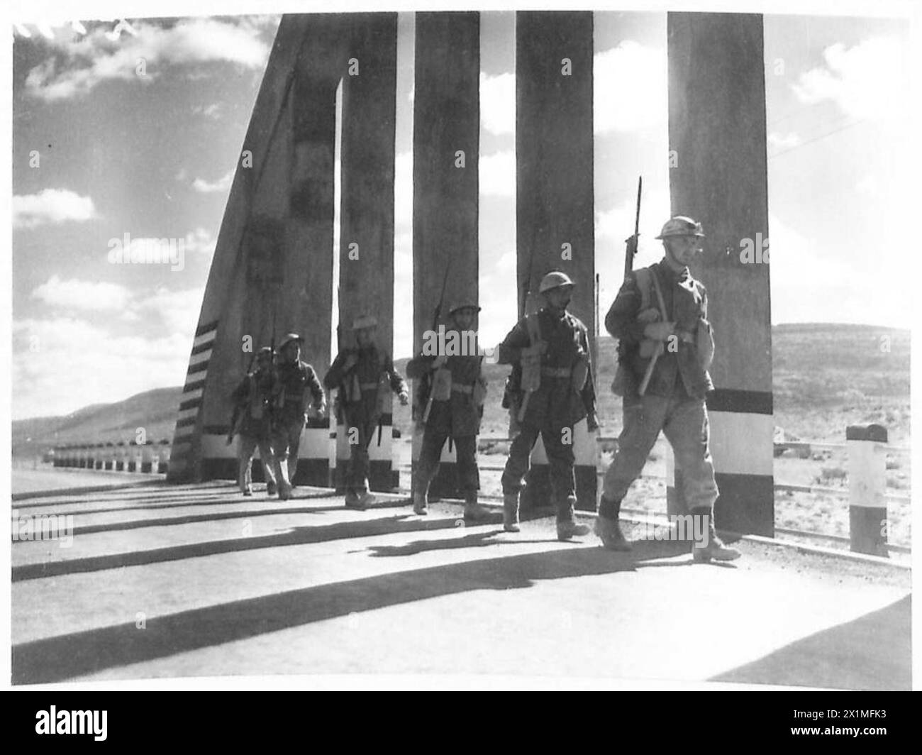 LATEST PICTURES FROM DERNA - Troops passing over one of the few bridges ...