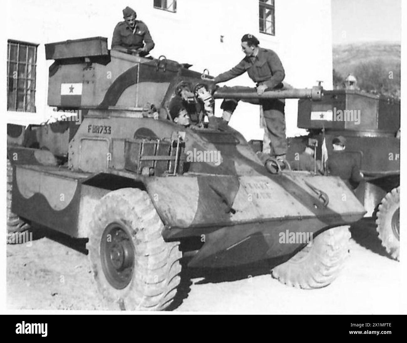 Yugoslav Partisan crews perform maintenance on their armored cars under ...