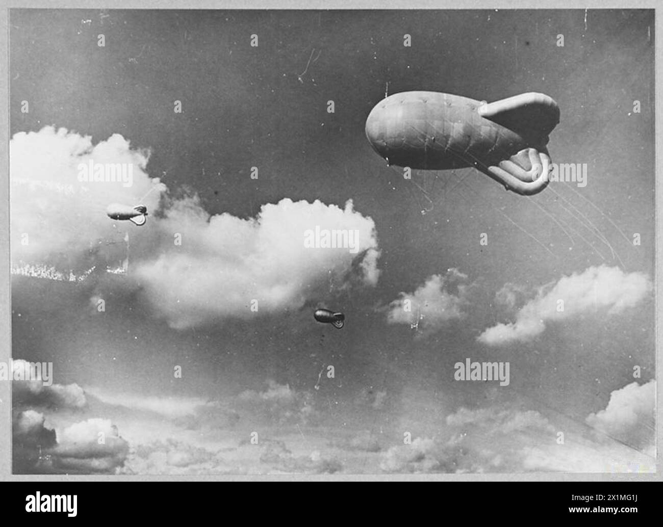 RAF personnel practice balloon barrage formations to defend against ...