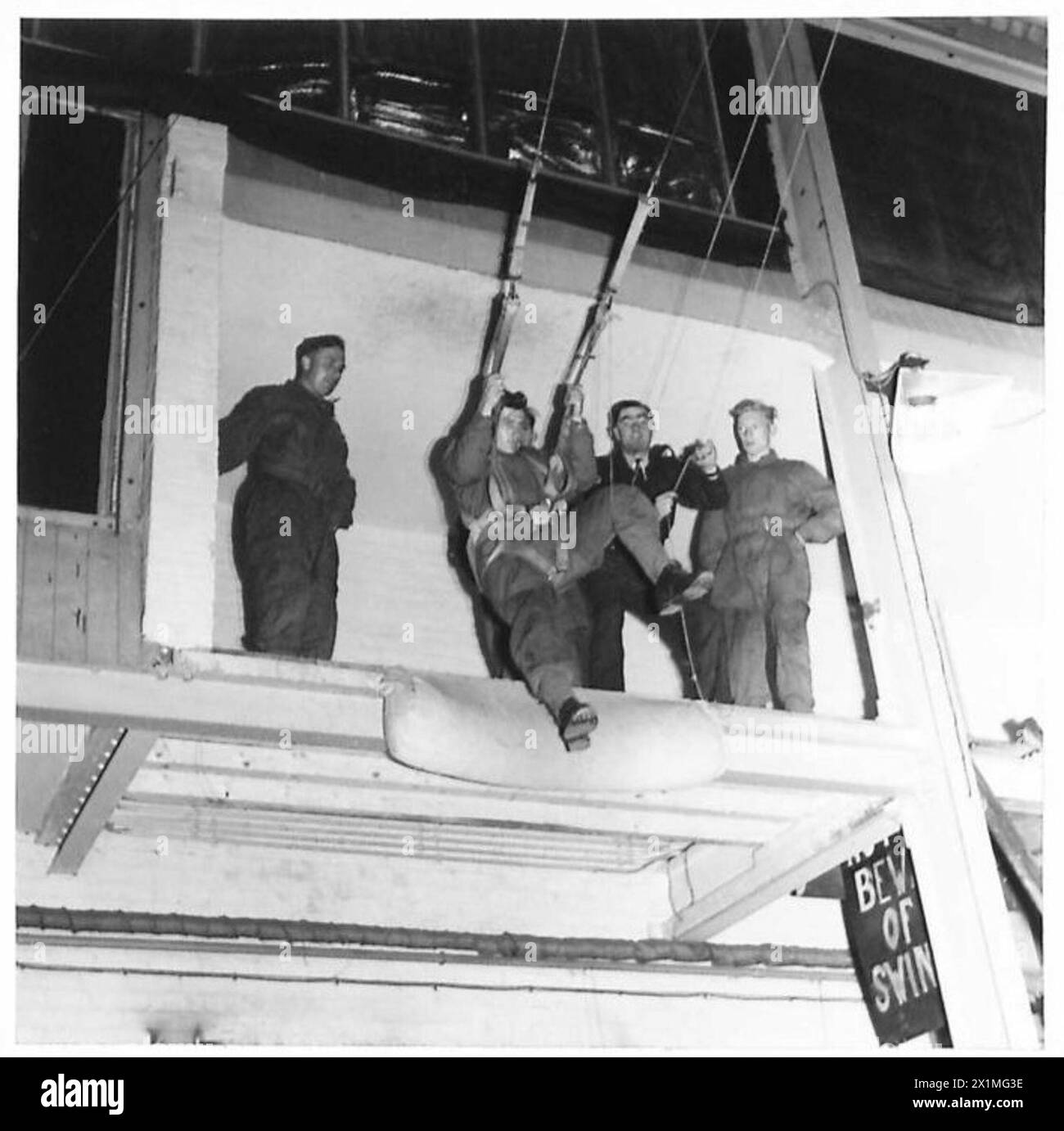 PARATROOPS IN TRAINING - About to swing and release his leg from an ...