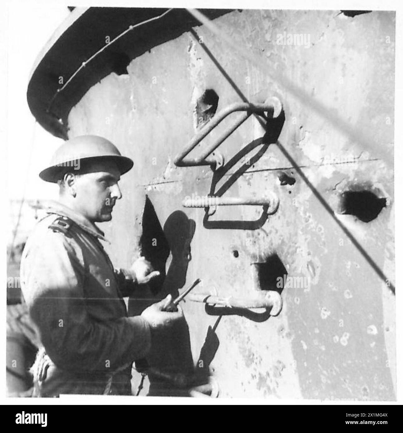 Lieutenant O. Bolton, RNVR., leads the boarding party of H.M. Fleet ...