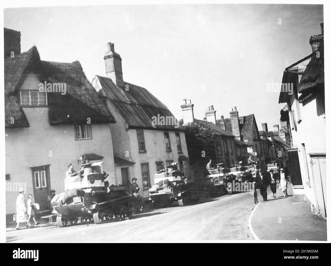 ACTIVITY IN EAST ANGLIA - A line of light reconnaisance tanks passing ...