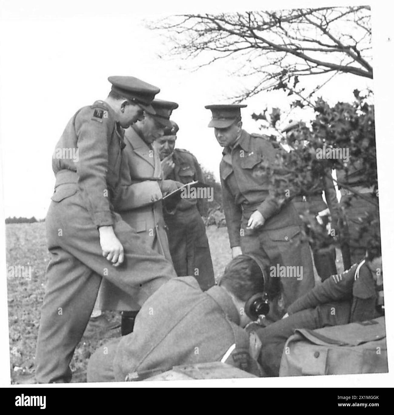 The King inspects messages and communications at a Royal Artillery post ...