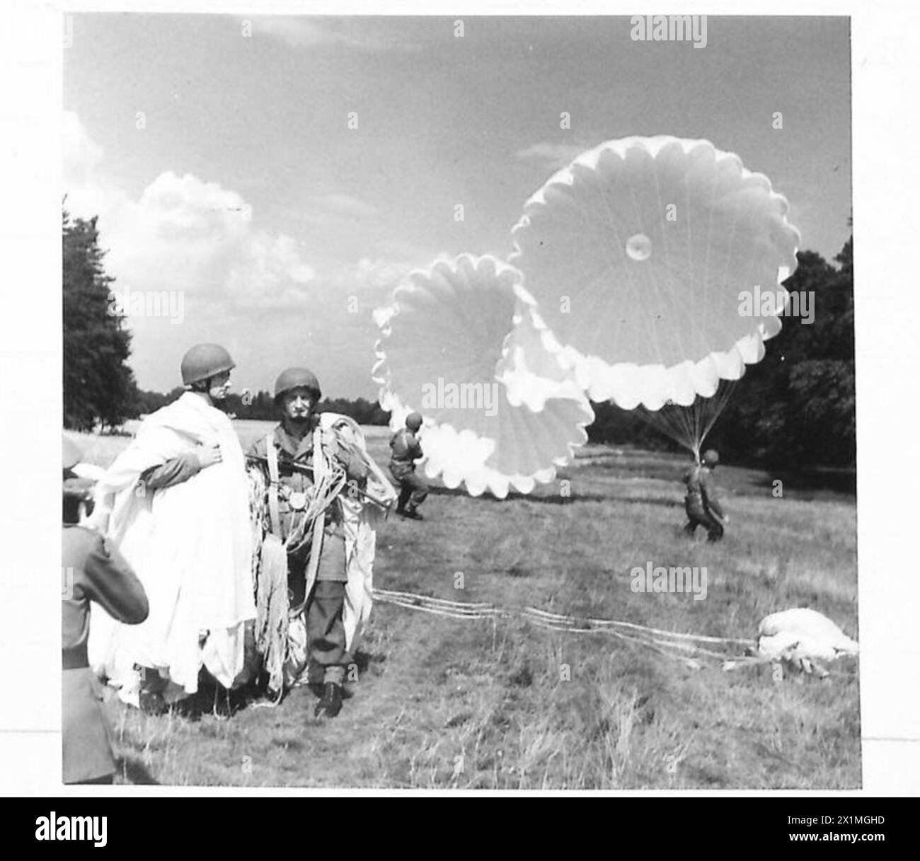 Paratroops of the British Army display their parachutes following a ...