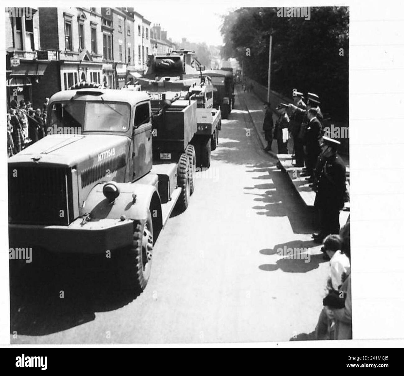 British Army troops and vehicles pass a saluting base in Loughborough ...