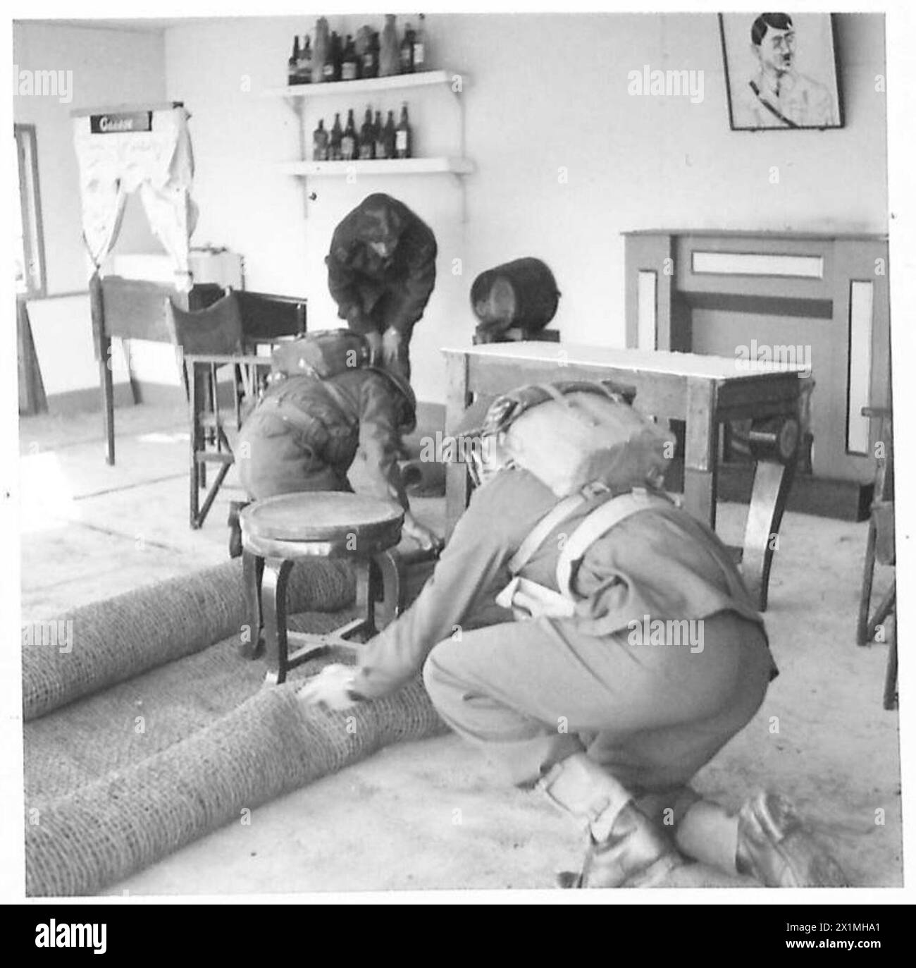 Sappers inspect furniture, walls, floors, and carpets for booby traps ...