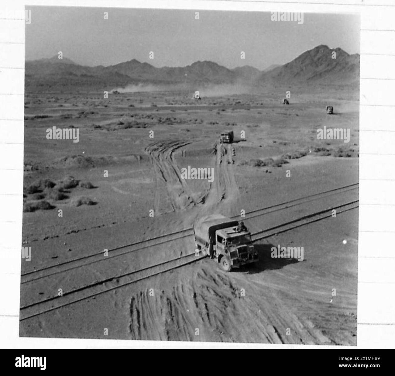 The head of a convoy of United Nations forces passes over the derelict ...
