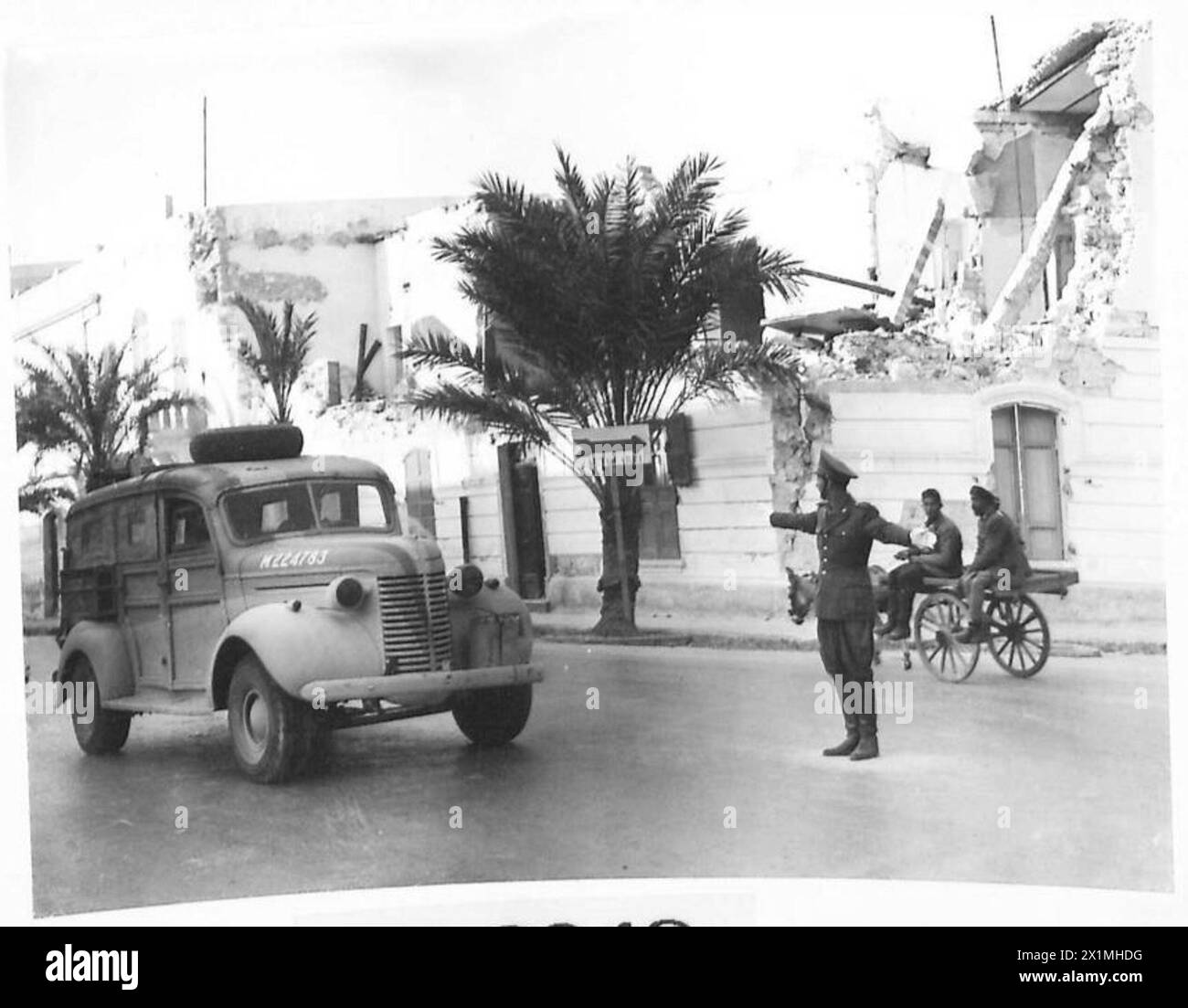 THE LIBYAN CAMPAIGN - An Italian policemen directing traffic in Bengazi ...