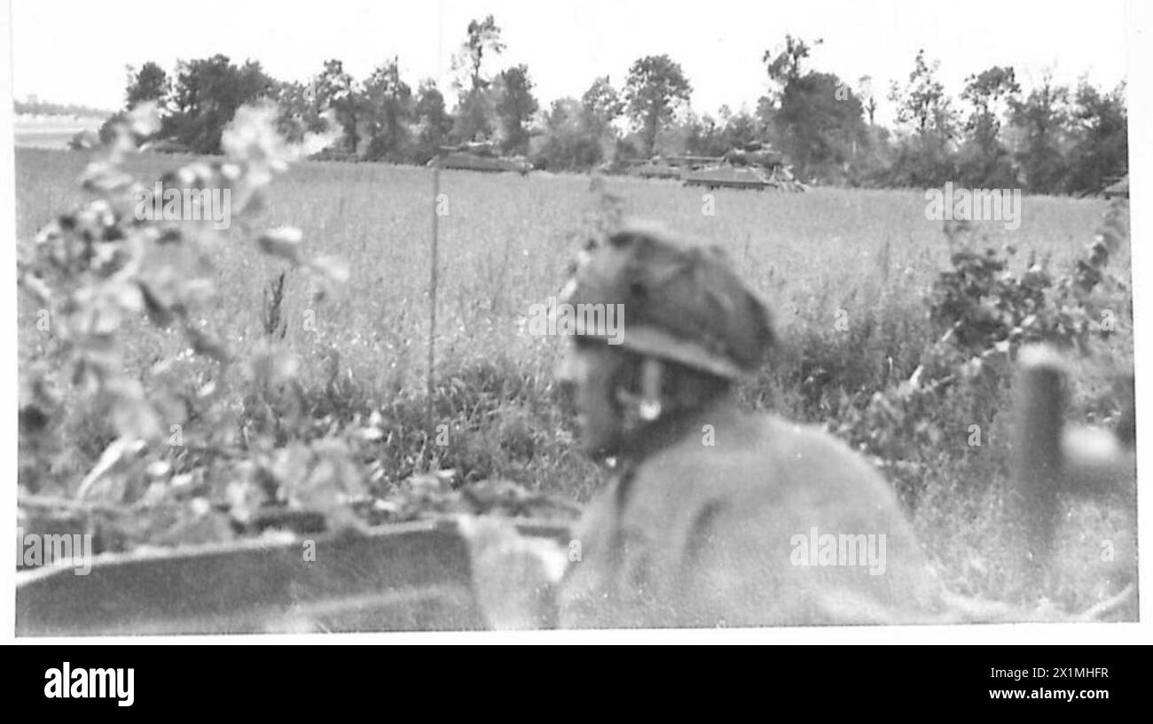 Sherman tanks of the 11th Armoured Division engage enemy positions near ...