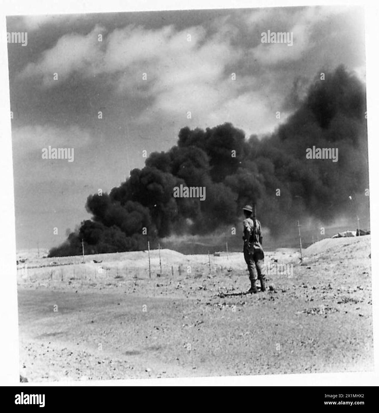 FIRE IN TOBRUK - This fire was started by a shell from an enemy long ...