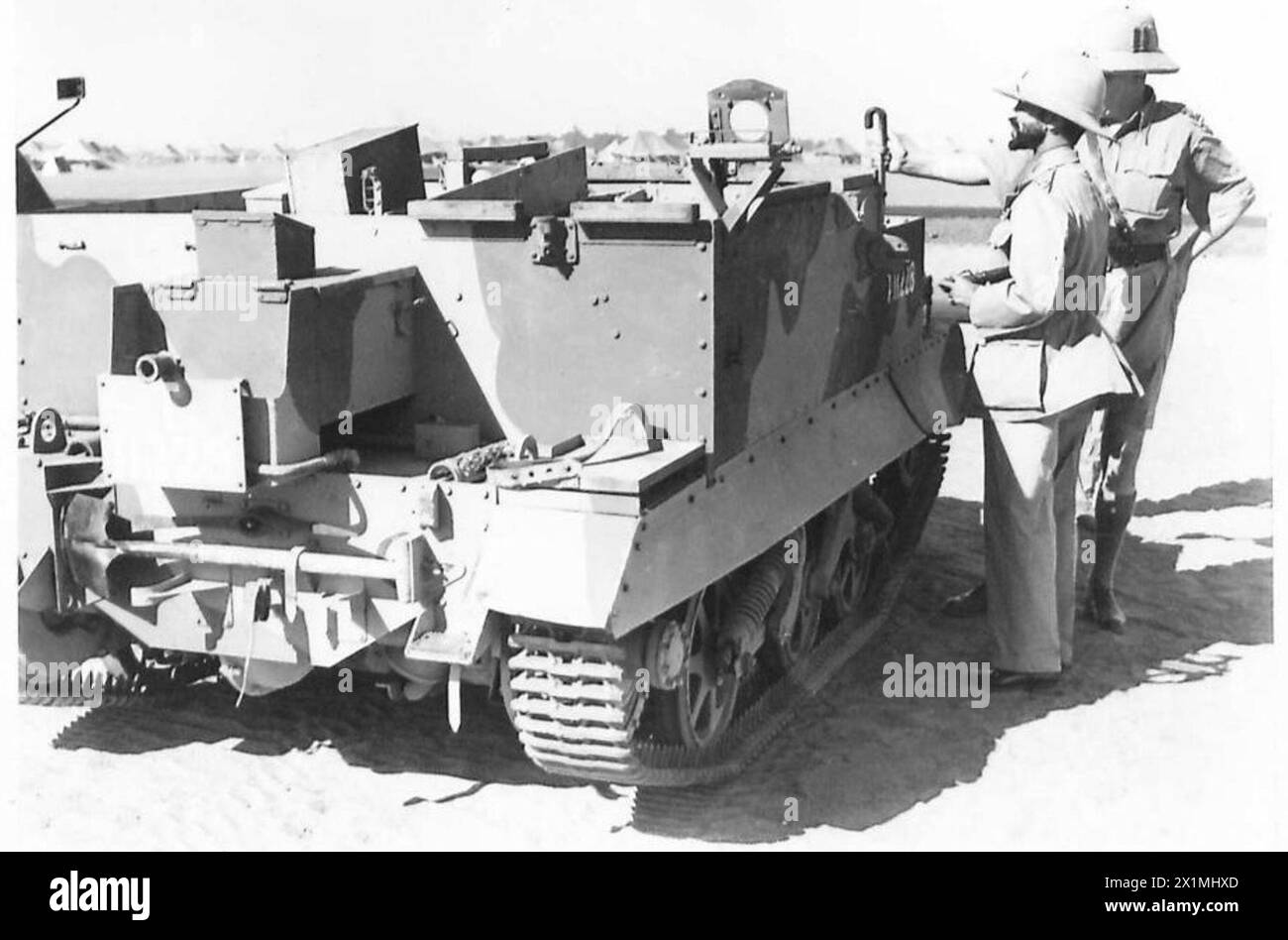EMPEROR OF ABYSSINIA SEES HIS FIRST BATTALION OFF - The Emperor inspecting a Bren gun carrier ...