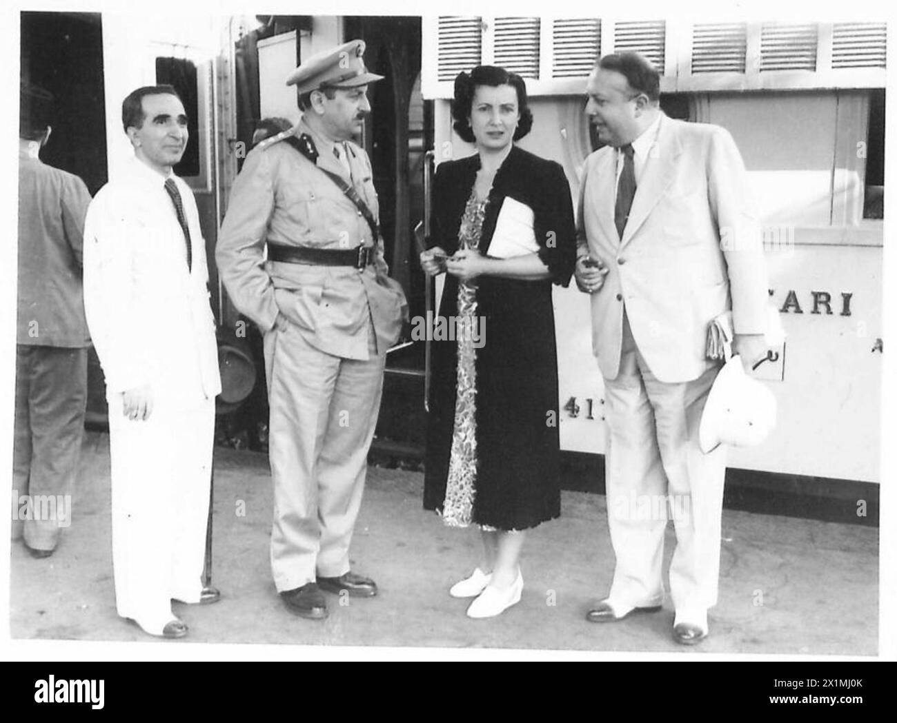 THE KING OF GREECE LEAVING CAIRO - Left to right: - Mr. Stavrinos ...