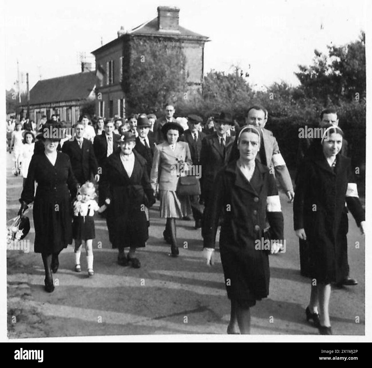 Members of the French Resistance (FFI) lead a procession through ...