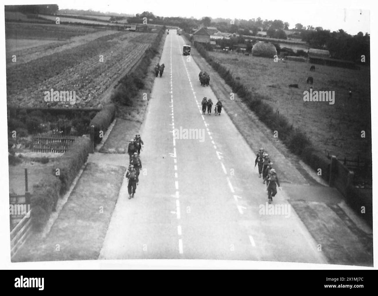 Infantry of the 1/7th Queens, 132nd Brigade, march in small parties ...